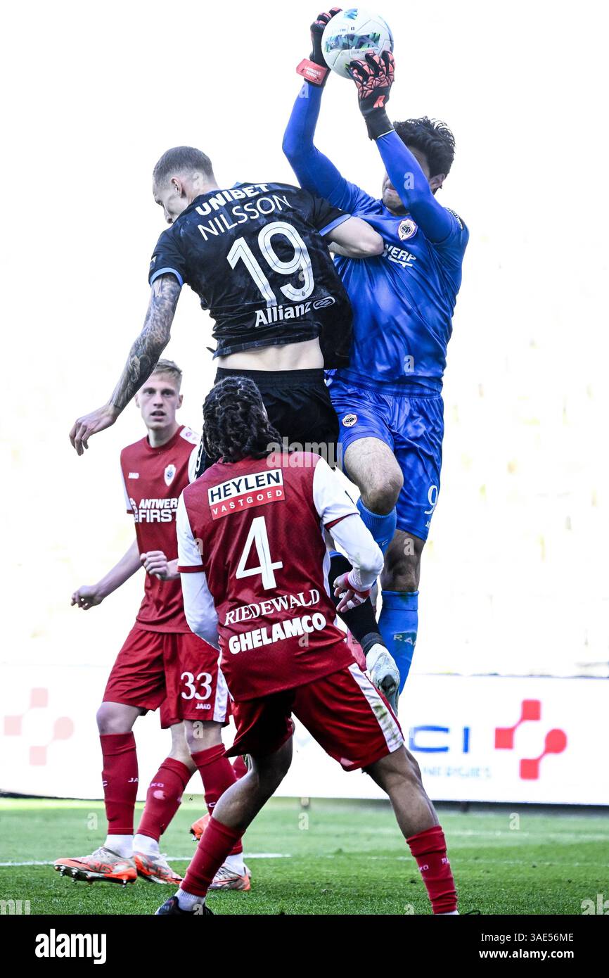 Antwerpen, Belgium. 06th Apr, 2025. Club's Gustaf Nilsson and Antwerp's goalkeeper Senne Lammens ...