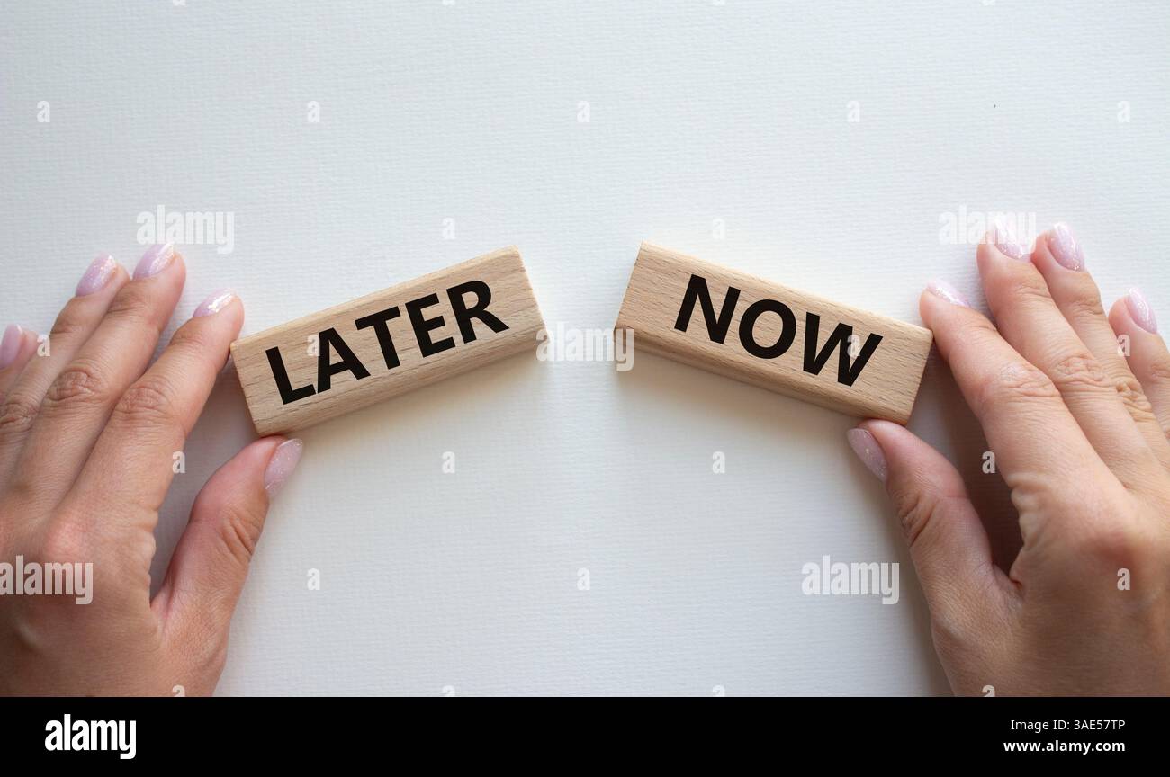 Now vs Later symbol. Concept word Now vs Later on wooden blocks ...
