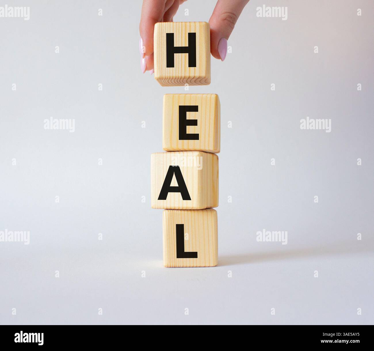 Heal symbol. Concept word Hate on wooden cubes. Doctor Heal. Beautiful ...