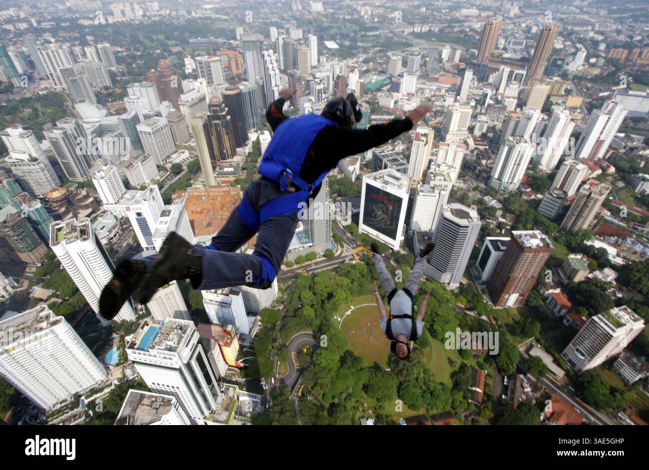 Aug 31, 2008 - Kuala Lumpur, Malaysia - A BASE jumper leaps before ...
