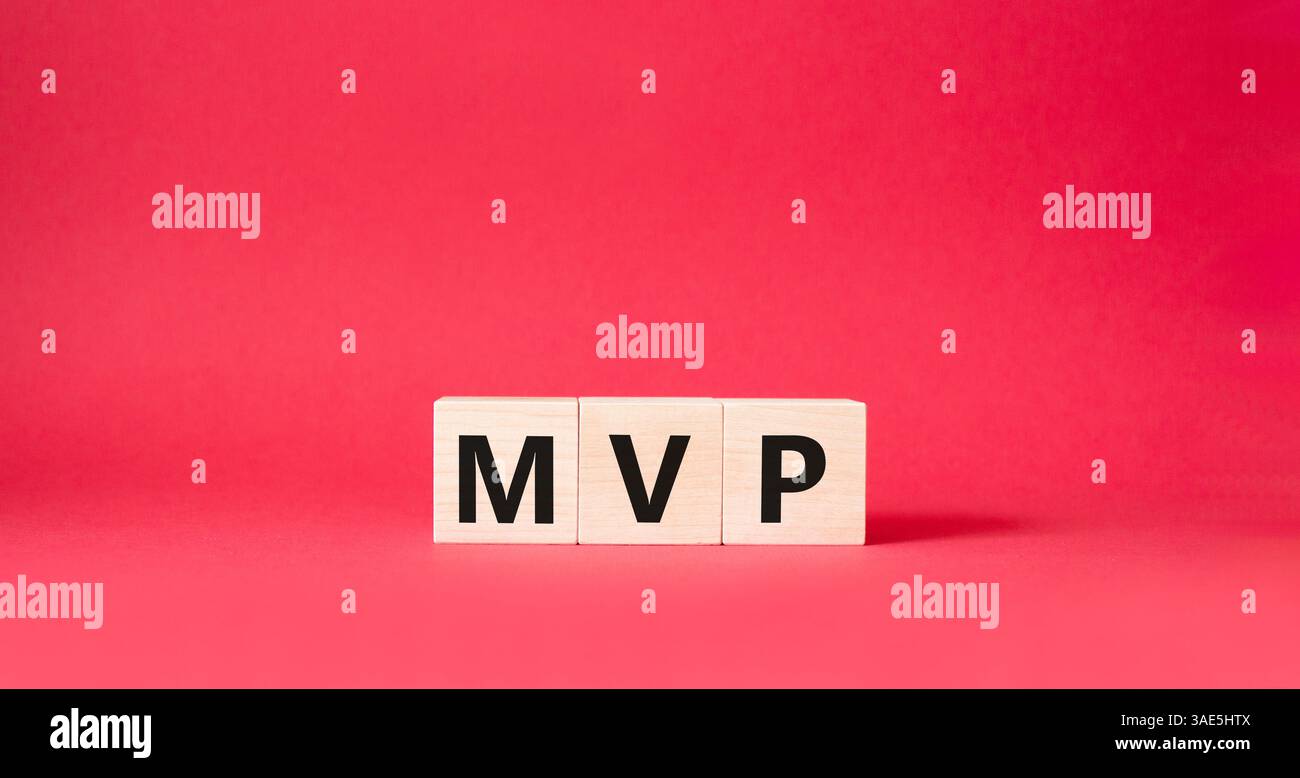 MVP symbol. Wooden cubes with words MVP. Beautiful red background ...