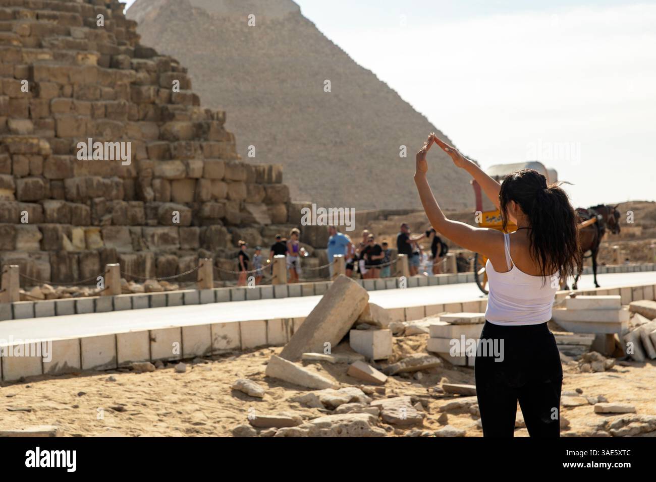 Cairo, Egypt; January 20, 2024: Capture the moment as a tourist poses ...