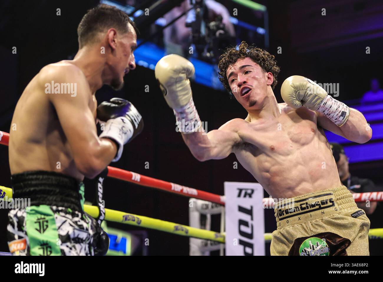 April 5, 2025: (R-L) Junior Bantamweight Steven Navarro throws an upper ...