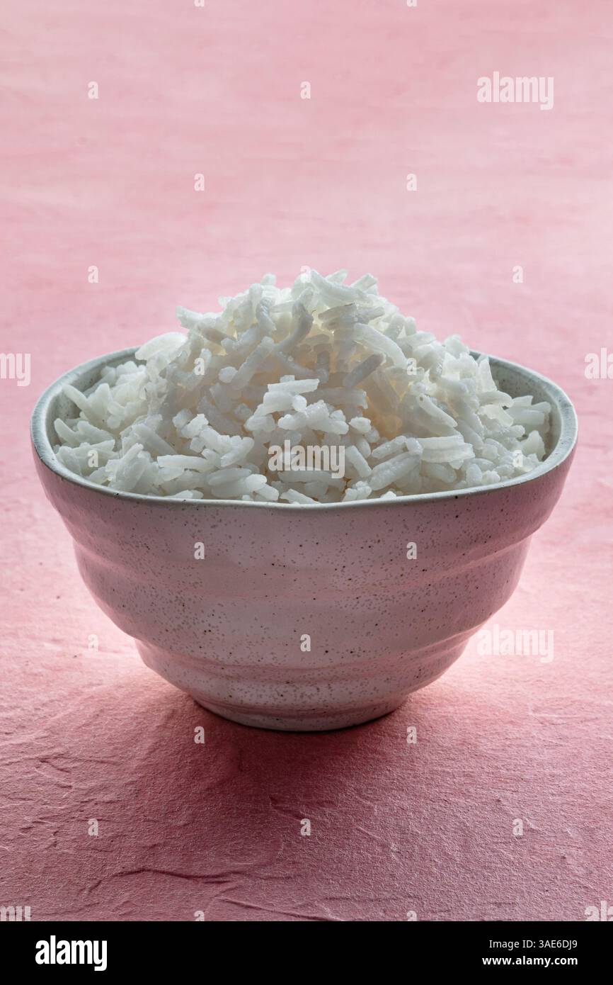 White rice, cooked. A bowl of boiled long grain rice, a simple side ...
