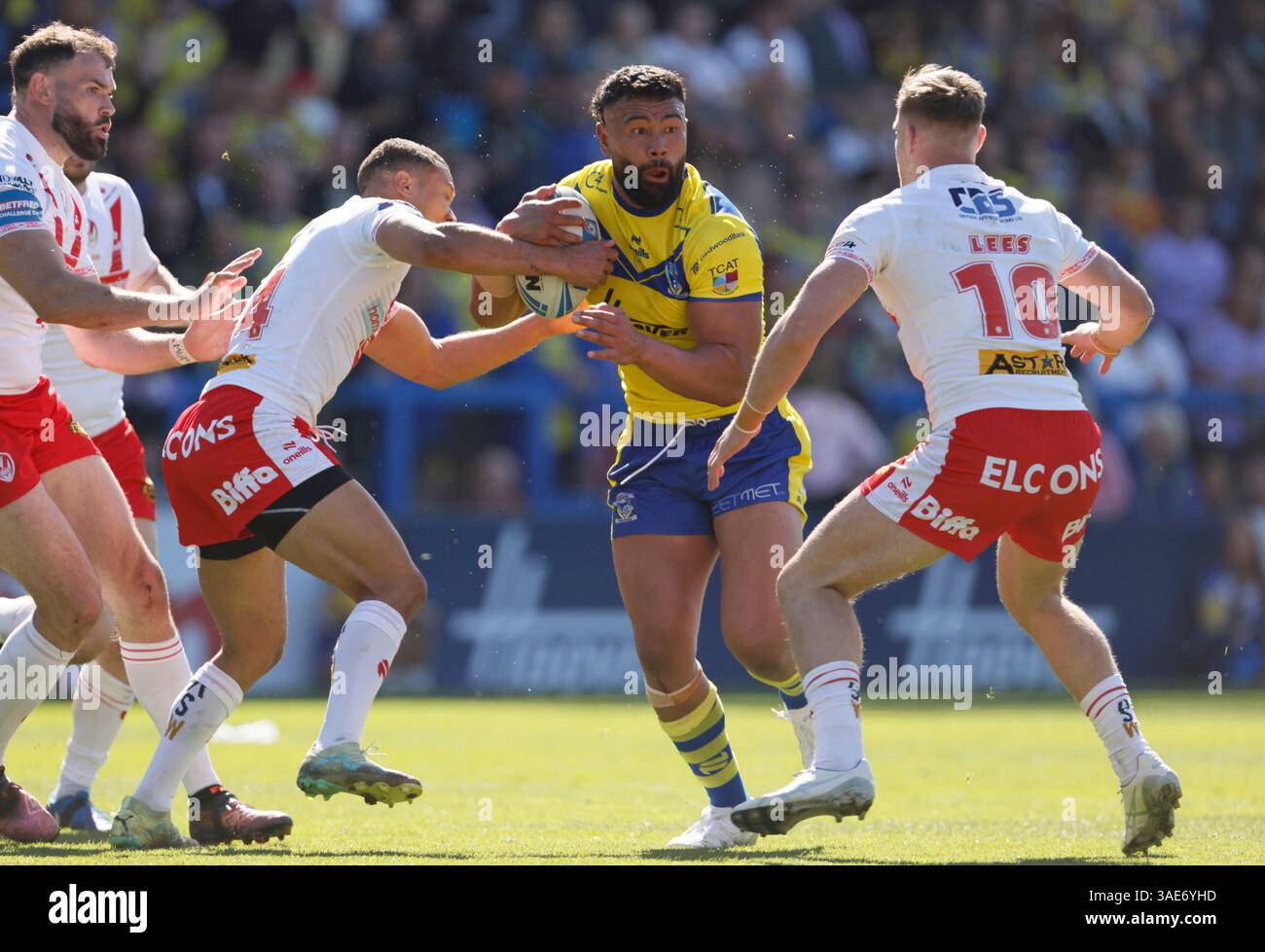 Warrington Wolves' Zane Musgrove (centre) is tackled by St Helens ...
