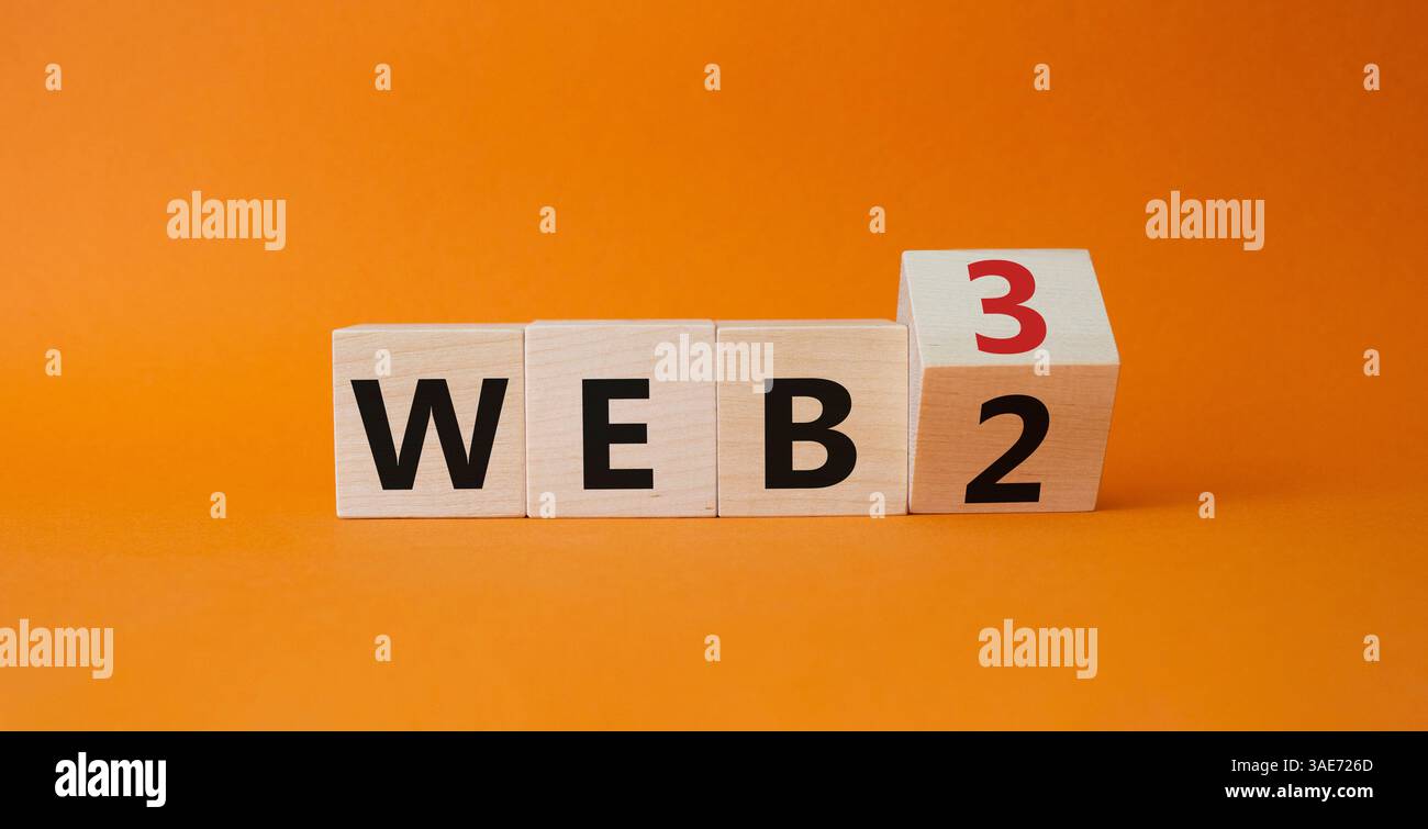 Web 3 vs Web 2 symbol. Turned wooden cubes with words web 2 vs web 3. Beautiful orange ...