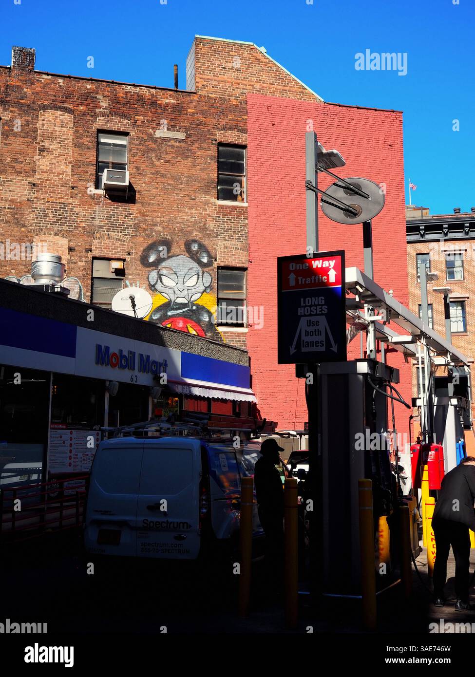 Urban Gas Station Scene with Street Art and Brick Buildings in New York ...