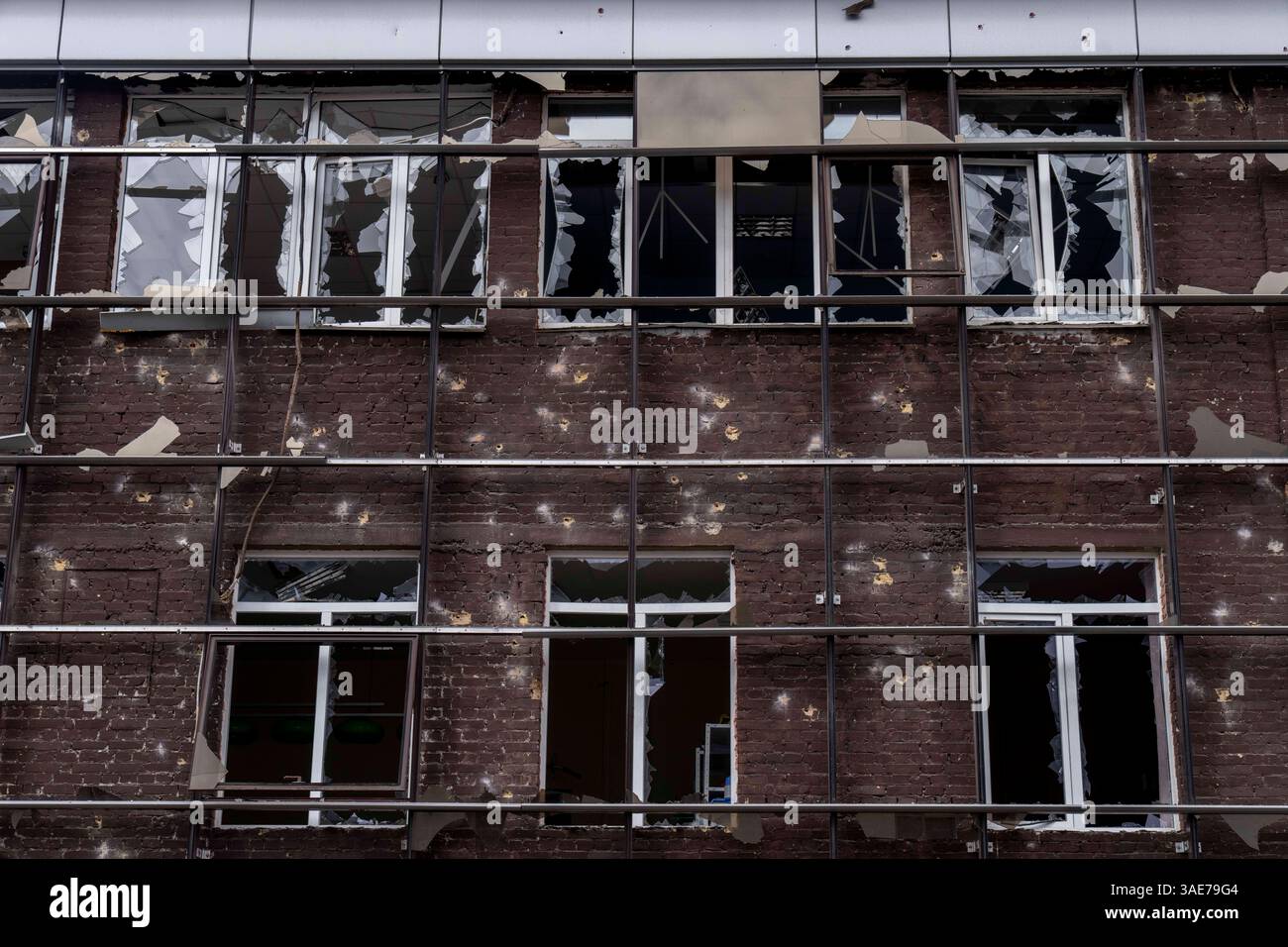 Building with shattered windows as a result of a Russian missile strike ...