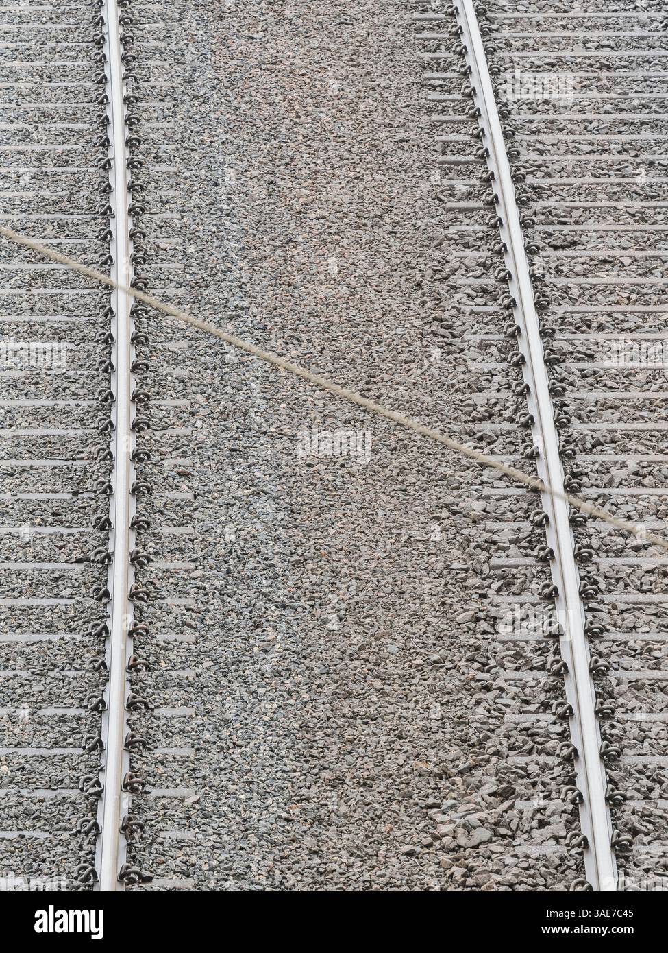 Railway tracks run parallel across a gravel bed in Gothenburg ...
