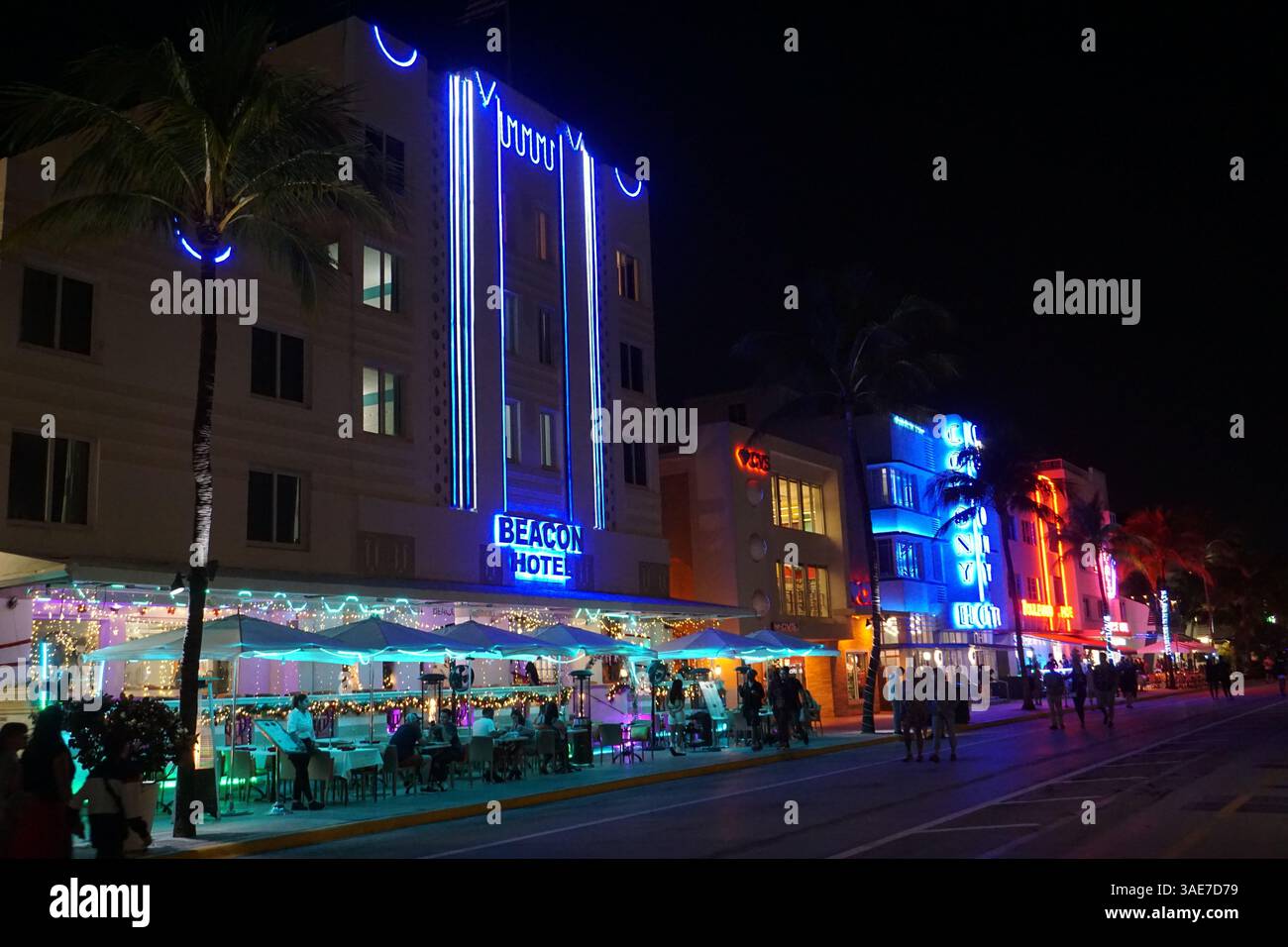 Busy night scene on the South Beach, Miami Beach boardwalk with neon ...