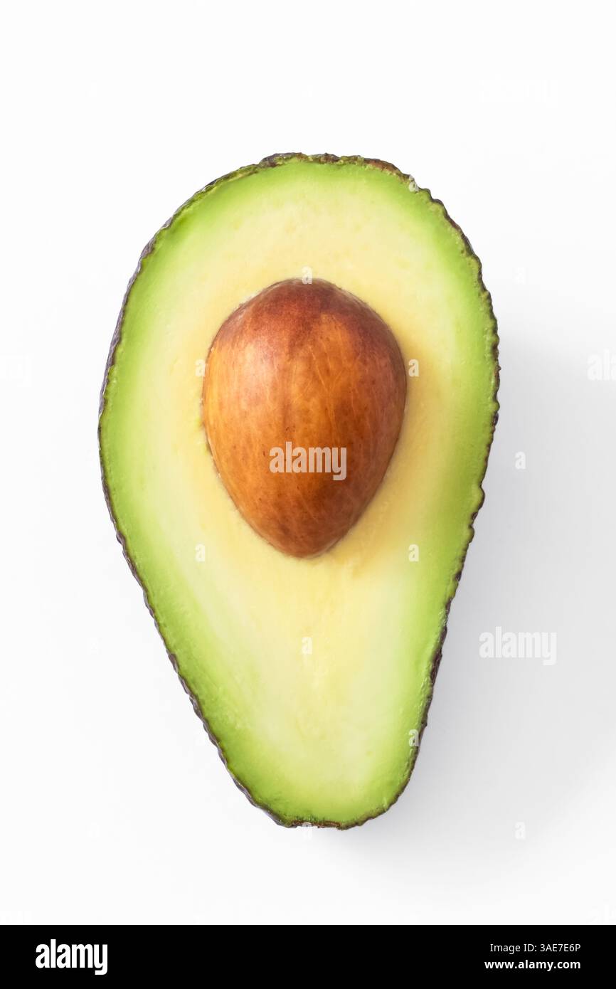 Ripe avocado cut. Avocado cut in half isolated on white background ...
