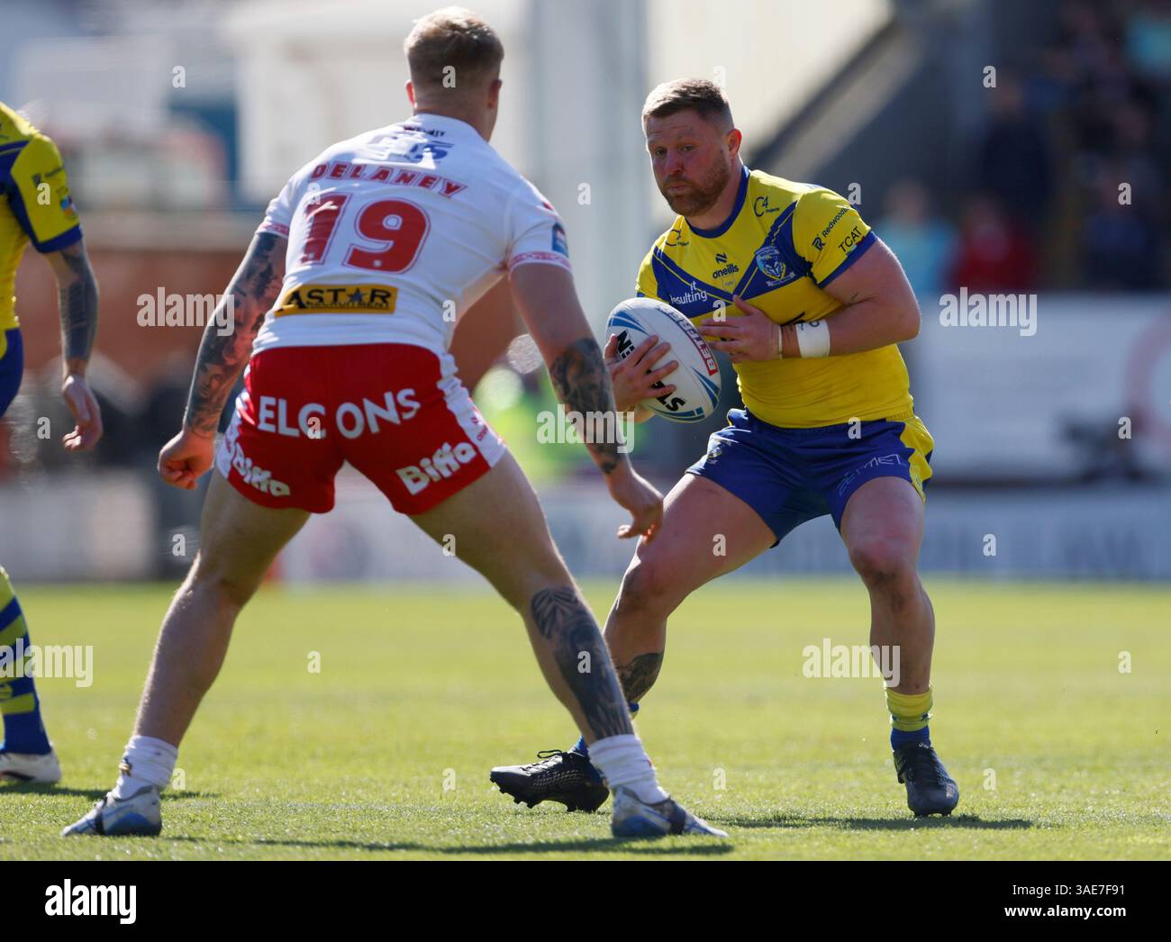 Warrington Wolves' Luke Yates (right) attempts to run past St Helens ...