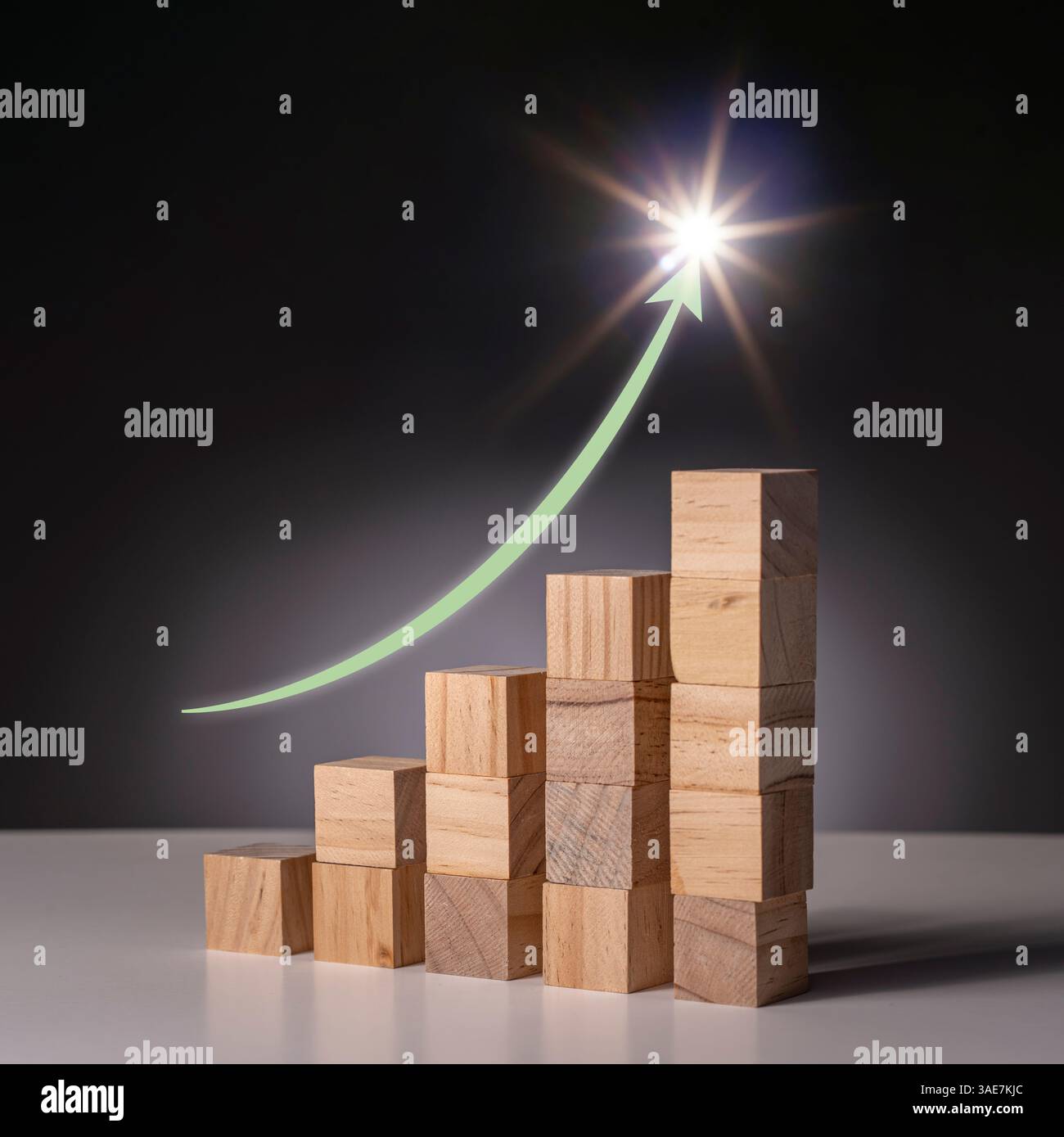 Wooden blocks arranged as a staircase with a green arrow pointing ...