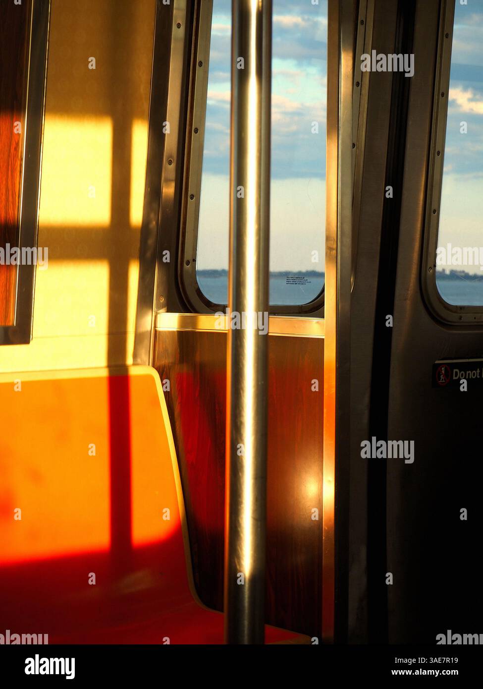 Sunlit New York City Subway Interior with View Through Window, Far ...