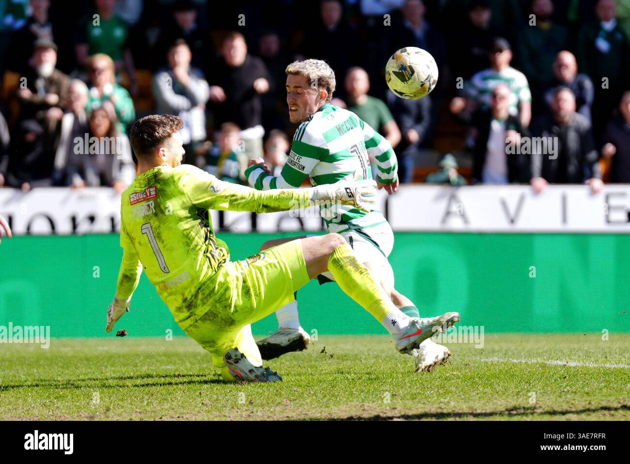 Celtic's Luke McCowan (right) has his effort on goal saved by St ...