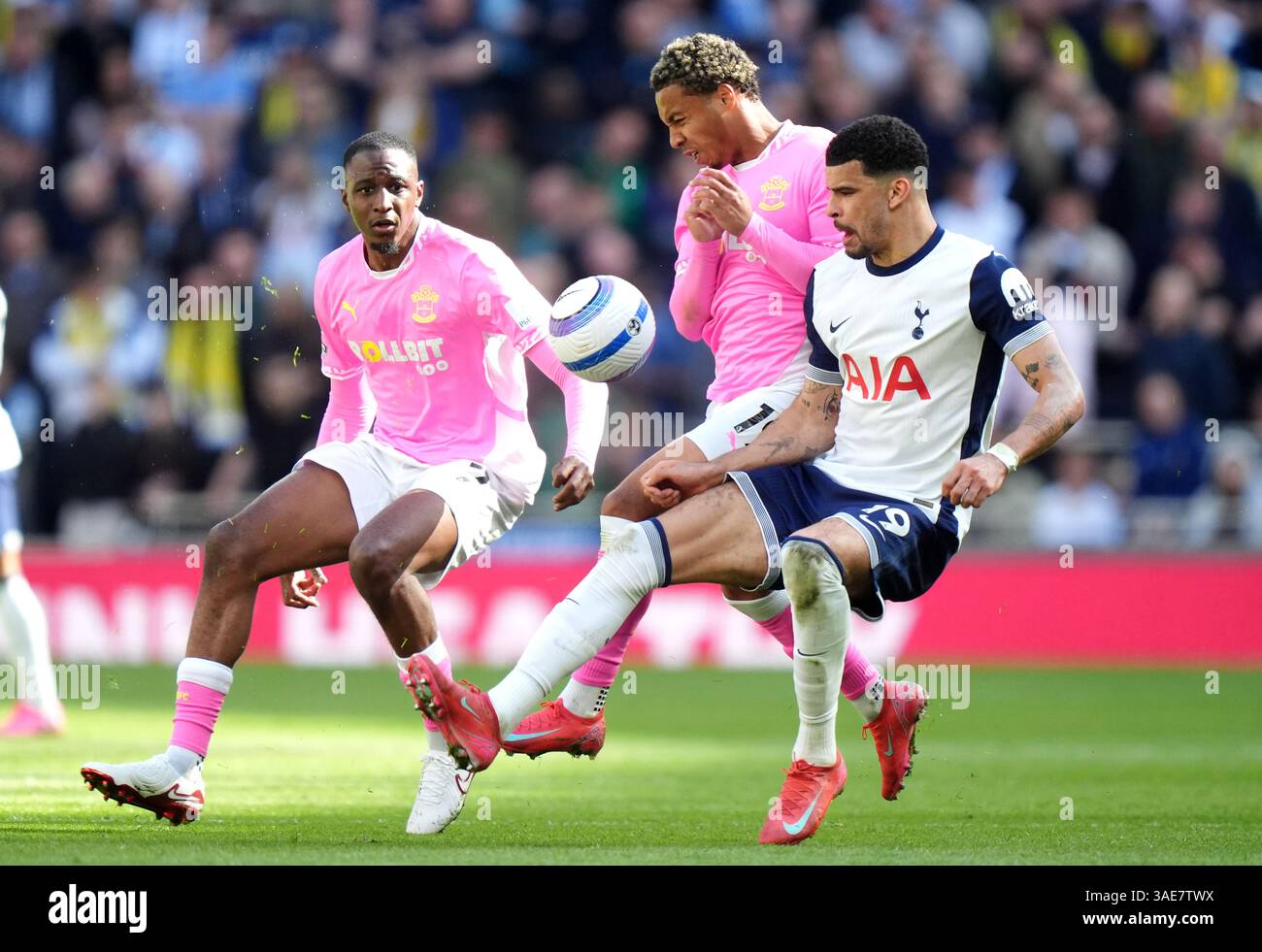 Tottenham Hotspur's Dominic Solanke (right) battle for the ball with ...