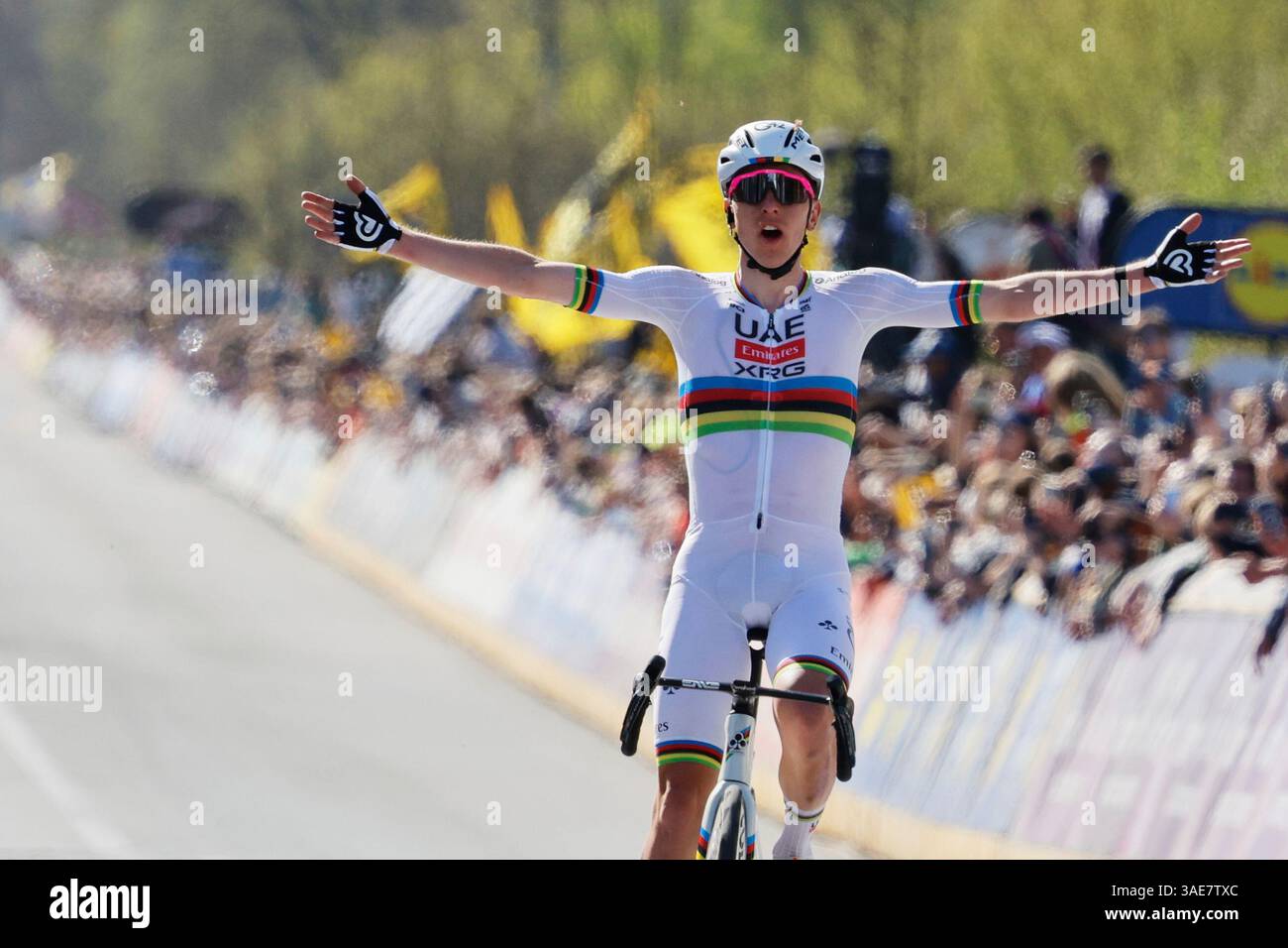 Slovenia's Tadej Pogacar, of the UAE Team Emirates XRG, crosses the ...