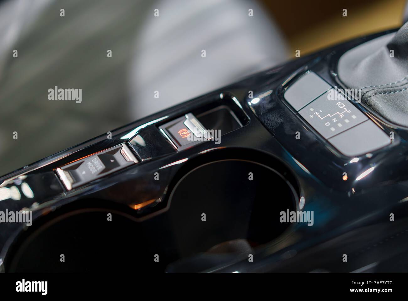 modern car console showcasing an electronic parking brake, drive mode ...