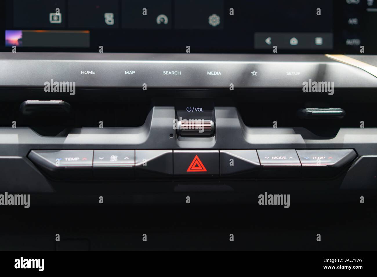 Modern car center console with volume knob, hazard button, and climate ...