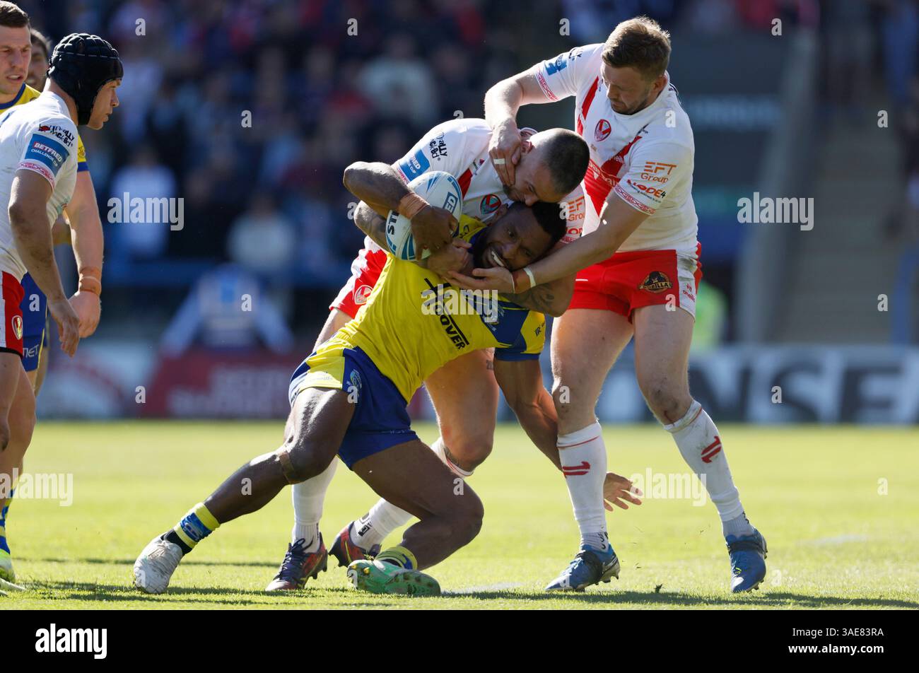 Warrington Wolves' Rodrick Tai is tackled during the Betfred Challenge ...
