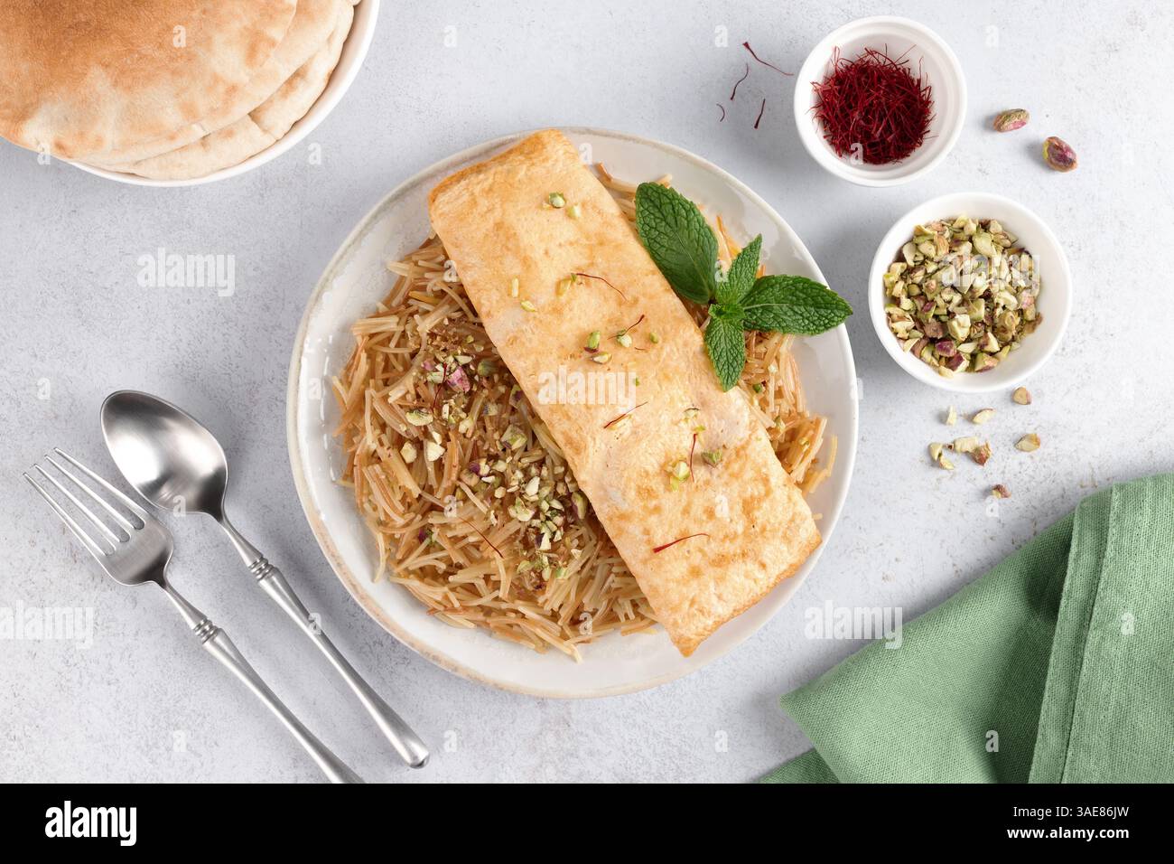 Arabic breakfast Balalit. Sweet vermicelli with spices, egg omelette ...