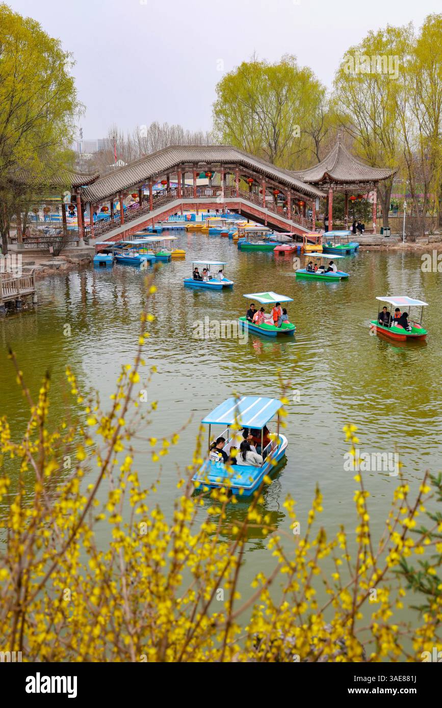 Beijing, China's Gansu Province. 6th Apr, 2025. People take boats for ...