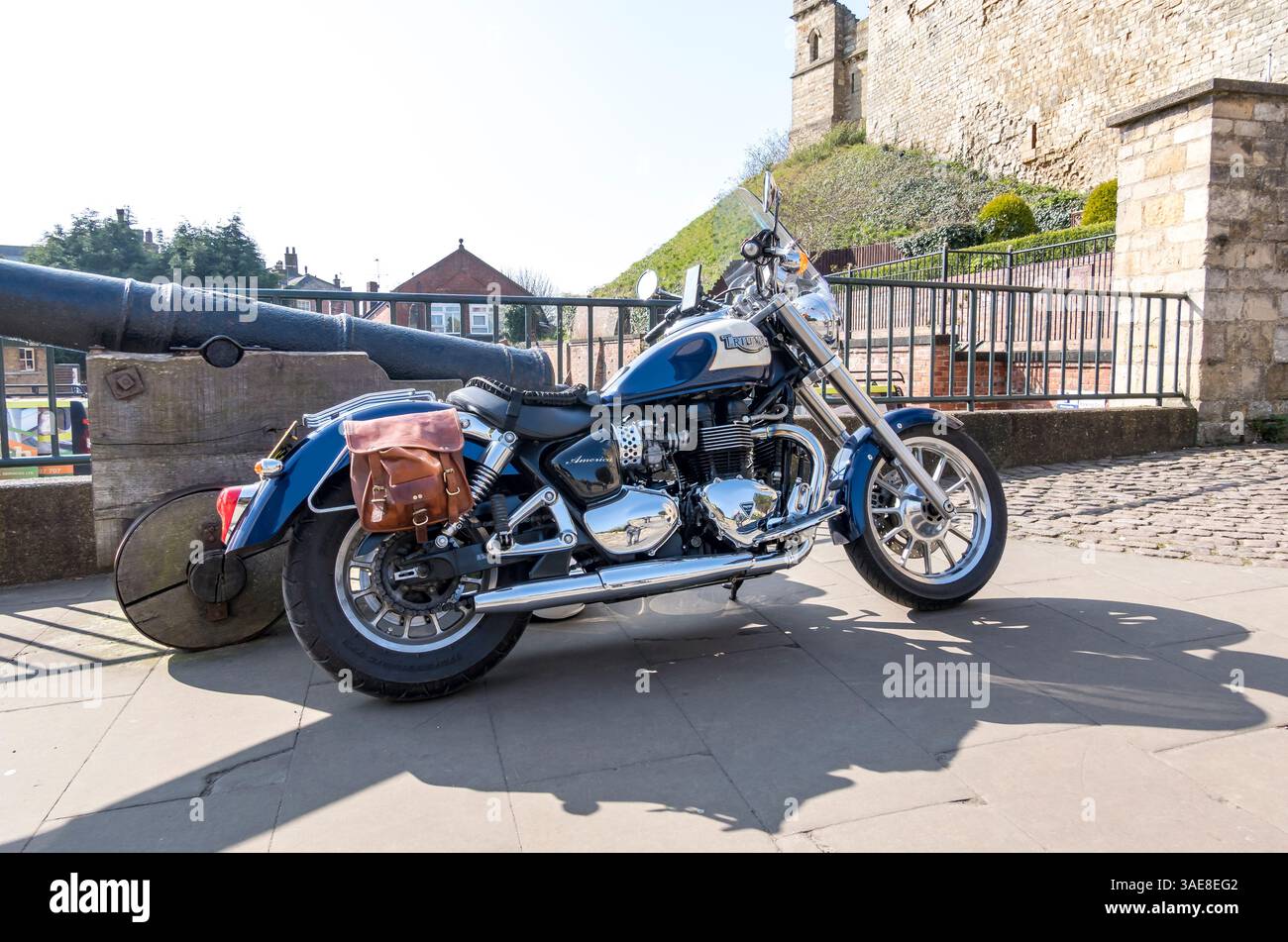 Triumph America cruiser motorbike parked outside Lincoln castle Stock ...
