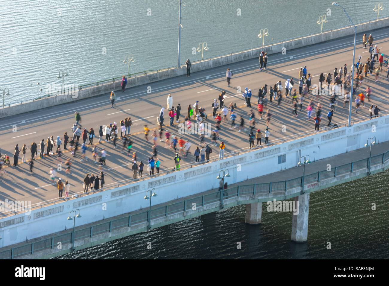 2025 Austin Marathon Runners in motion on Drake Bridge over Ladybird ...