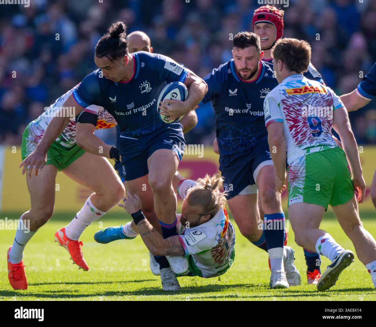 Dublin, Ireland. 06th Apr, 2025. James Lowe of Leinster tackled by Tyrone Green of Harlequins ...