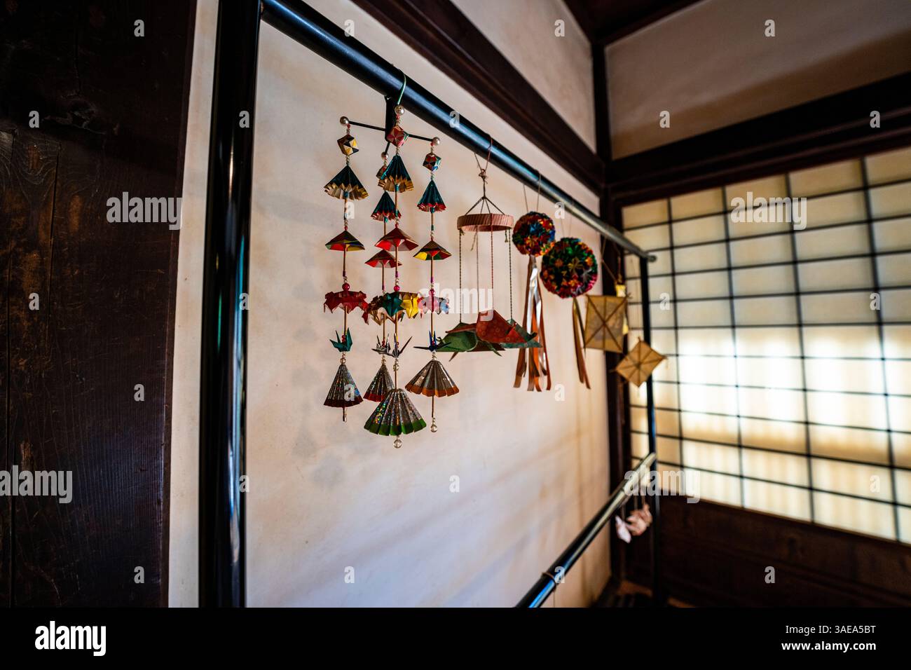 Traditional decorations in front of a shoji sliding paper screen in the ...