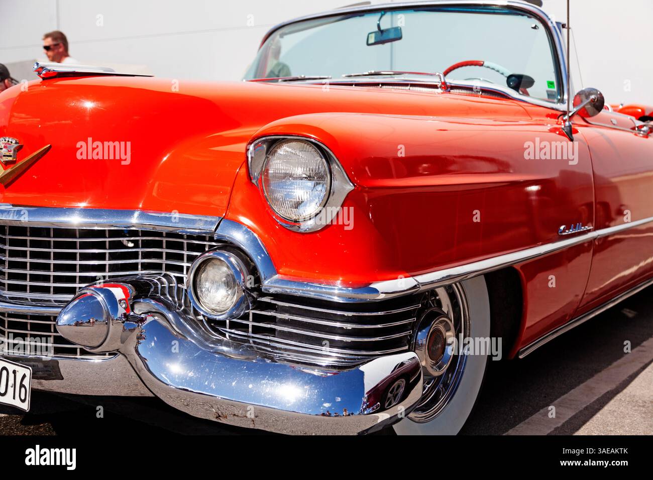 A luxurious red Cadillac convertible displaying classic 1950s elegance ...