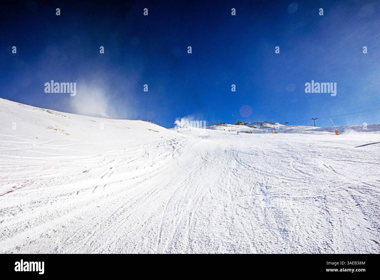 snowy slope with traces of beds on the slope. Opening of the ski season ...