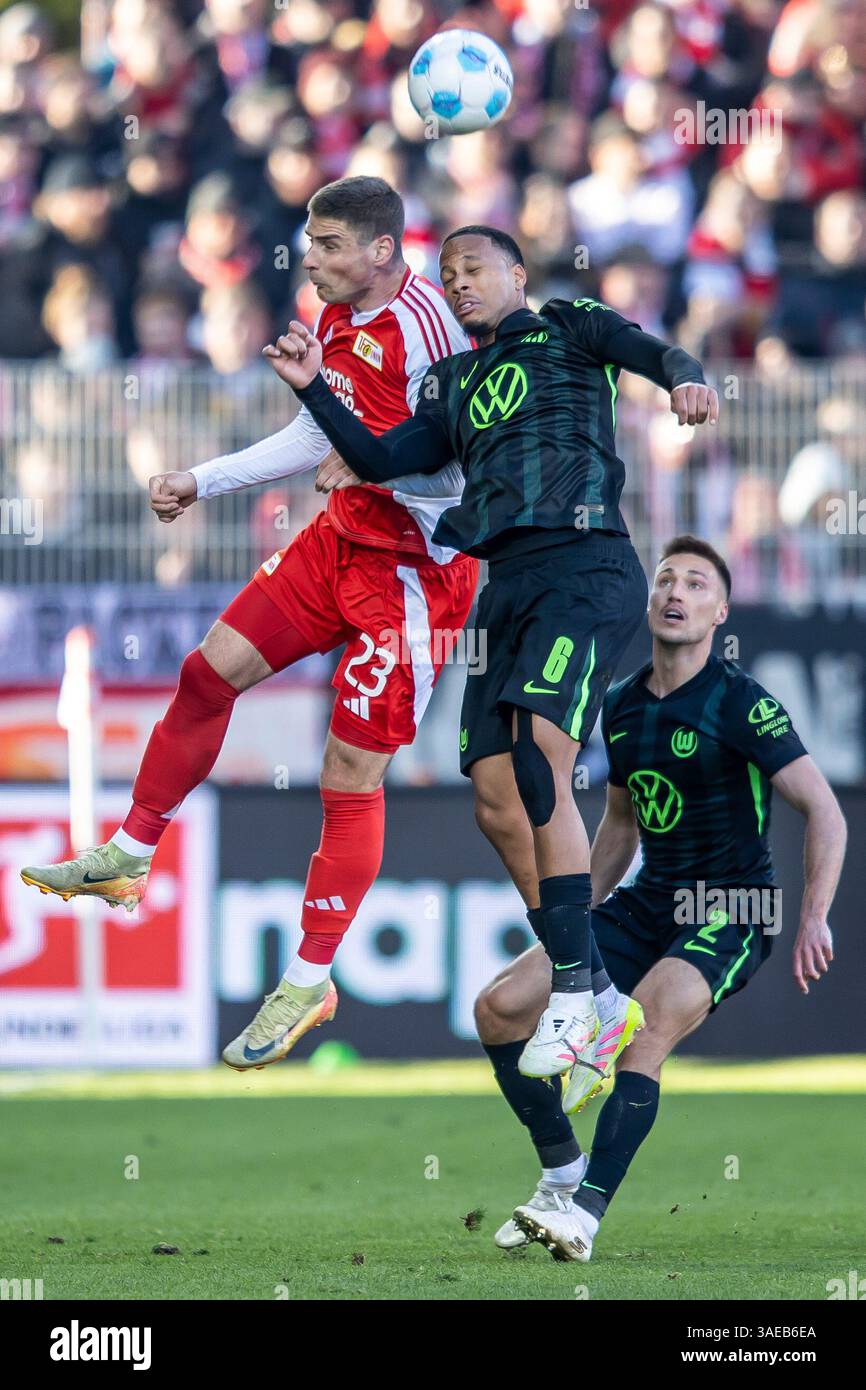 Berlin's Andrej Ilic, left, fights for the ball against VfL Wolfsburg's ...