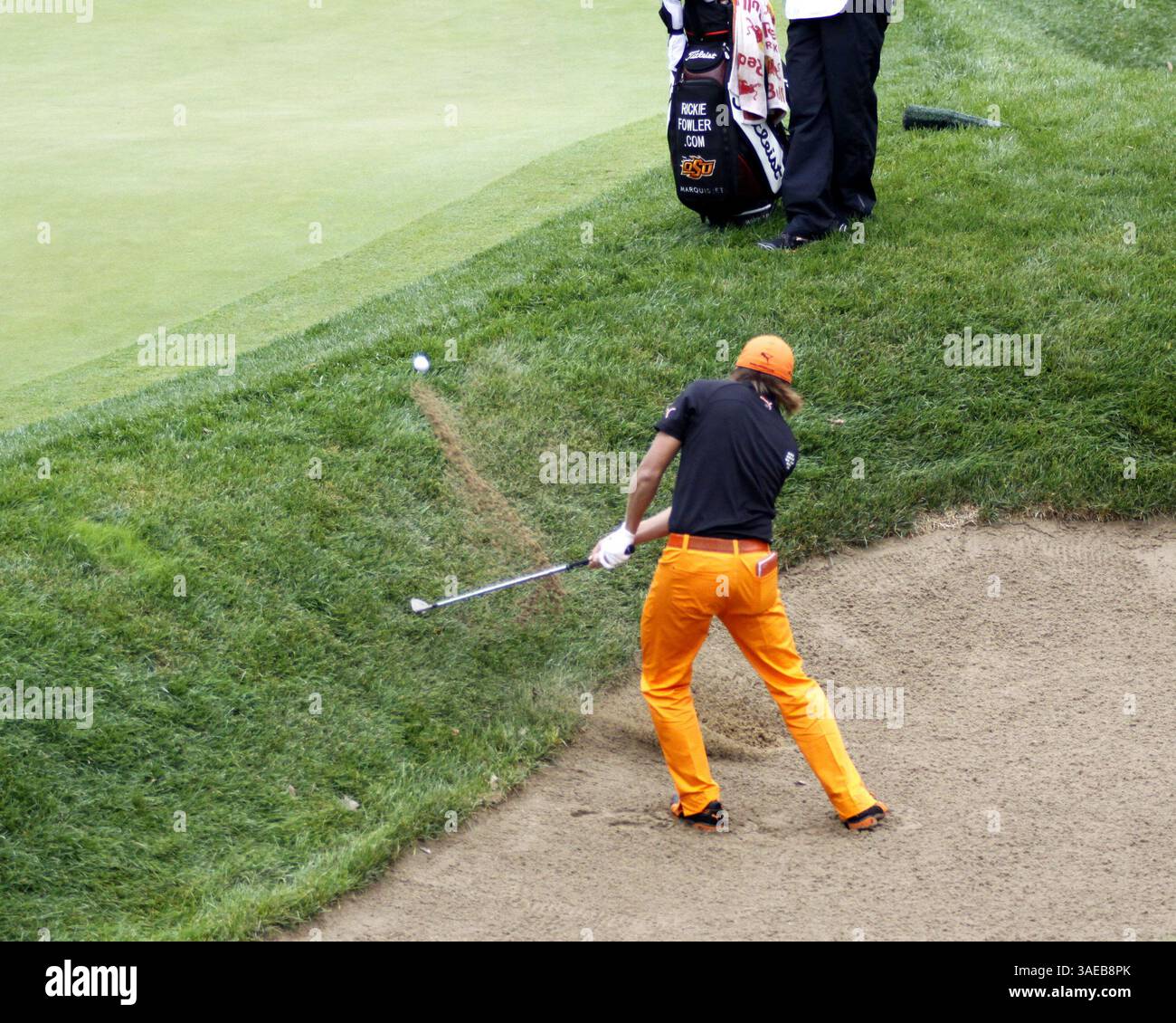 Lemont, IL - September 18, 2011: Ricky Fowler blasts his ball out of ...