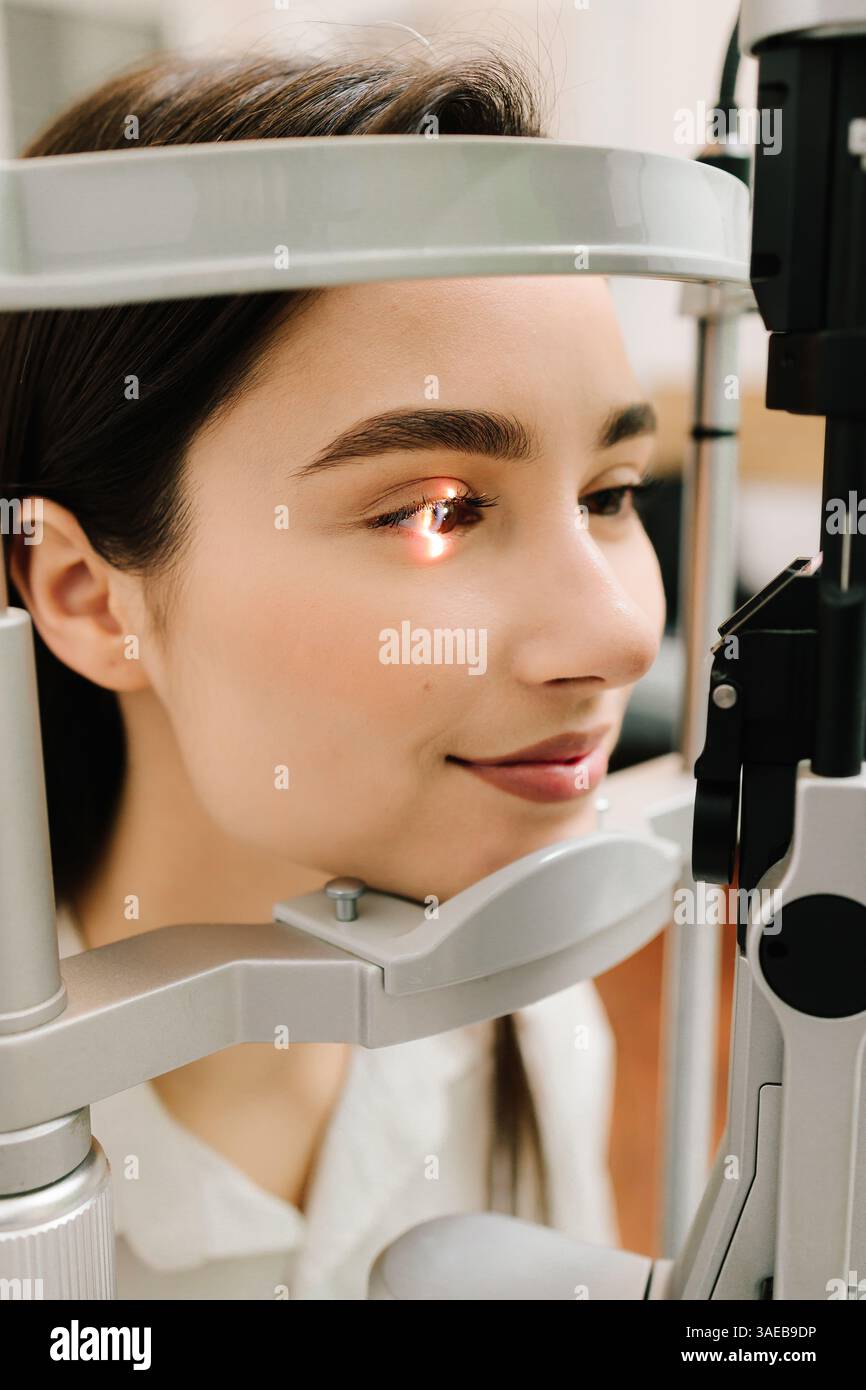 Slit lamp eye and cornea diagnostic at visiting ophthalmology clinic ...