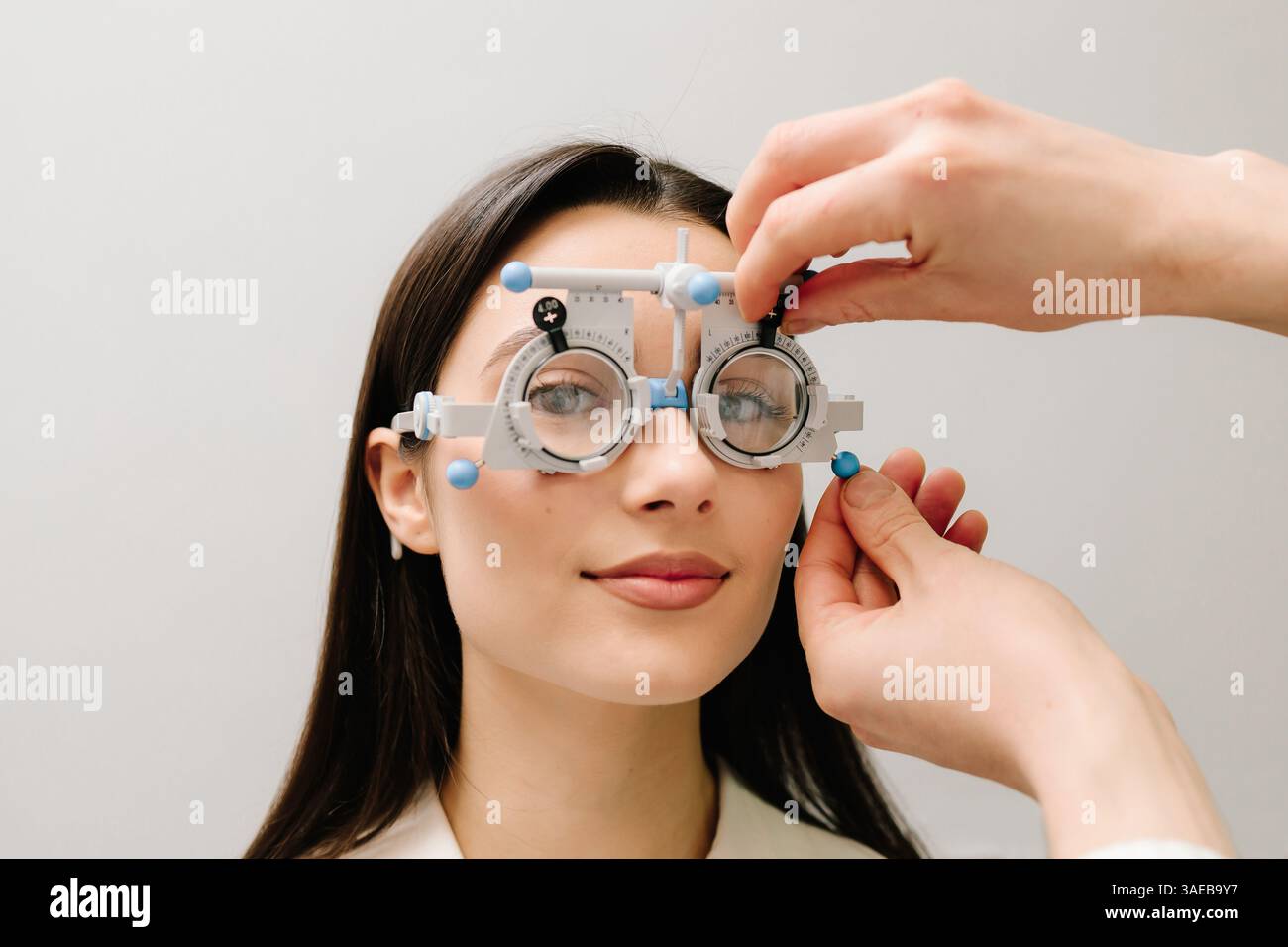 Trial frame glasses to determine the correct prescription lenses. Girl is wearing trial frame ...