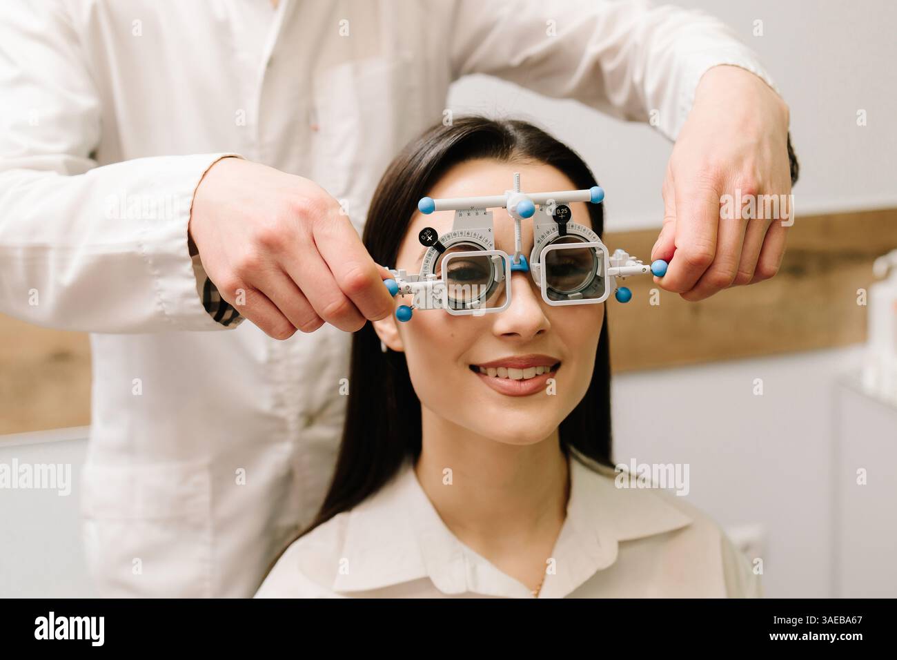 Trial frame glasses to determine the correct prescription lenses. Girl is wearing trial frame ...