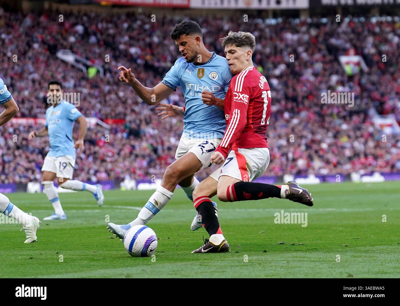 Manchester United's Alejandro Garnacho (right) and Manchester City's ...