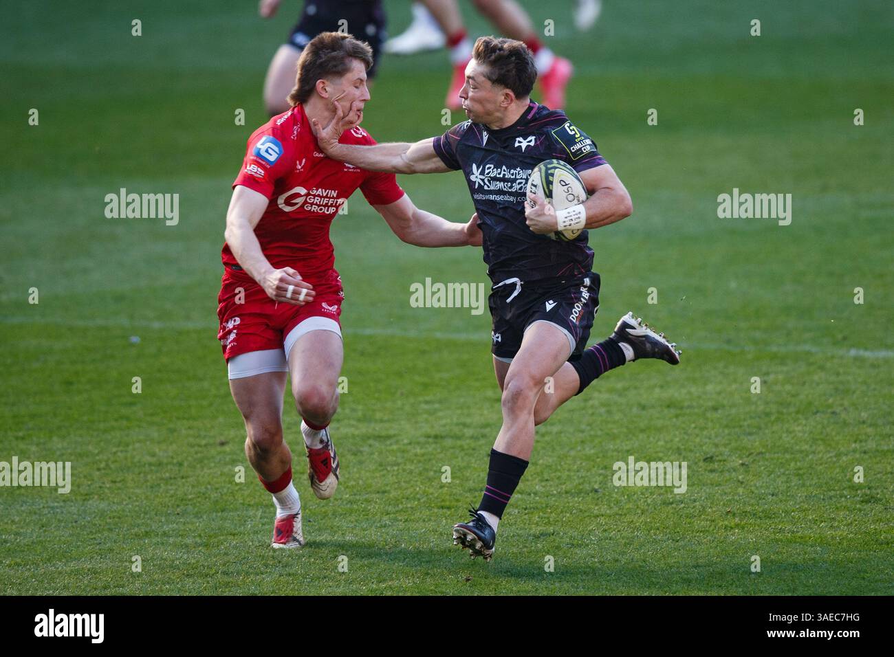 Swansea, UK. 6 April, 2025. Dan Edwards of Ospreys hands off Ellis Mee ...