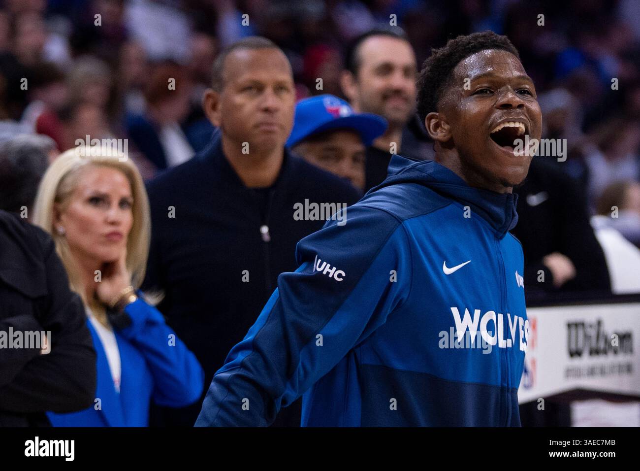 Minnesota Timberwolves' Anthony Edwards, right, reacts as Alex ...