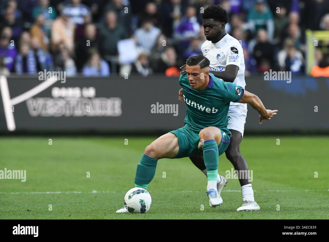 Brussels, Belgium. 06th Apr, 2025. Anderlecht's Jan-Carlo Simic and Genk's Christopher Bonsu ...