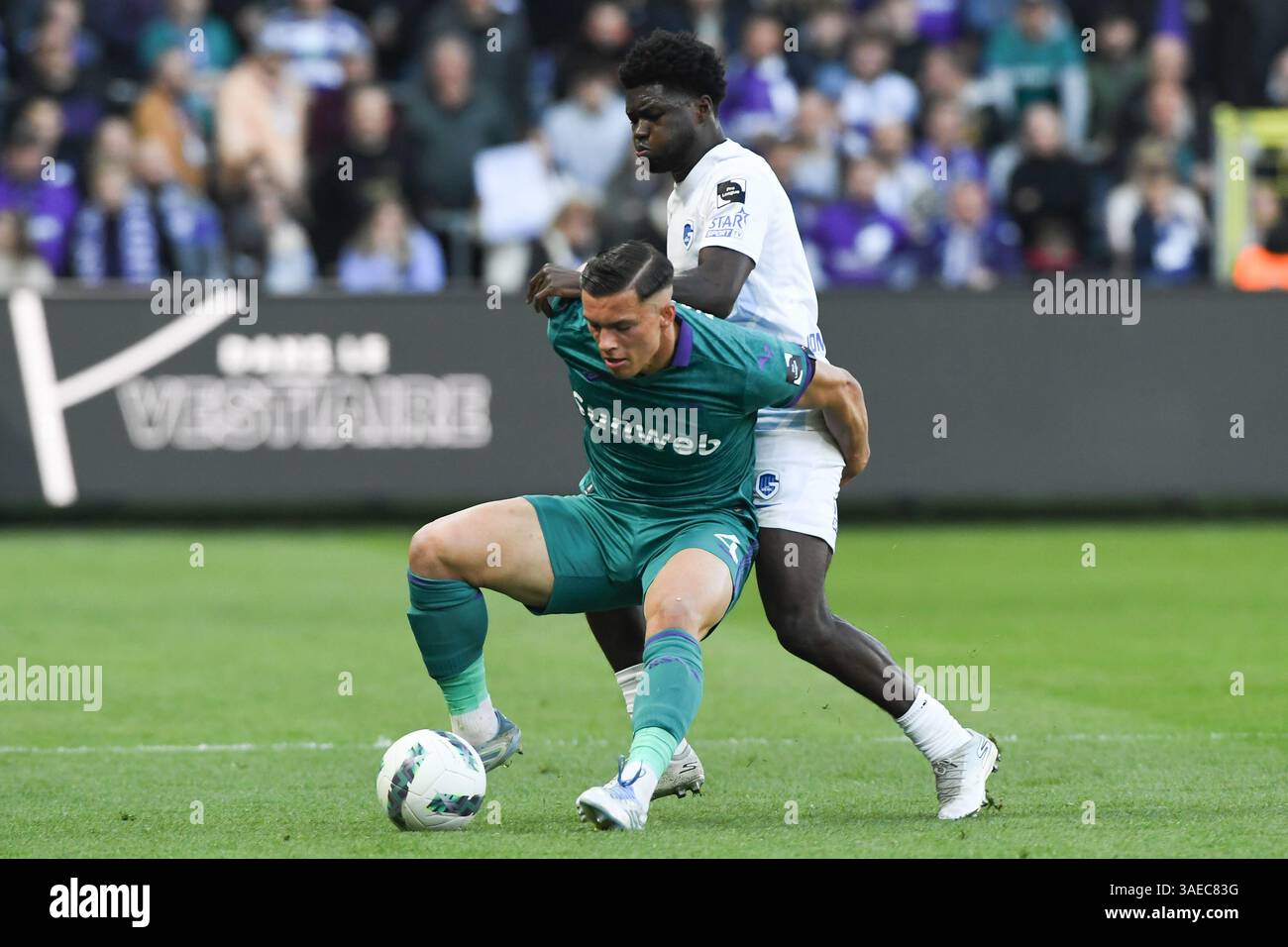 Brussels, Belgium. 06th Apr, 2025. Anderlecht's Jan-Carlo Simic and Genk's Christopher Bonsu ...