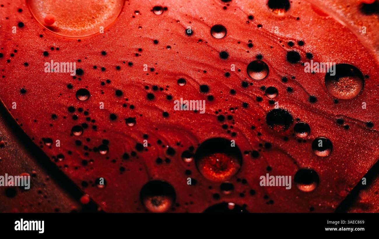 Bubble art. Sparkling fluid. Defocused red bronze color ink in water ...