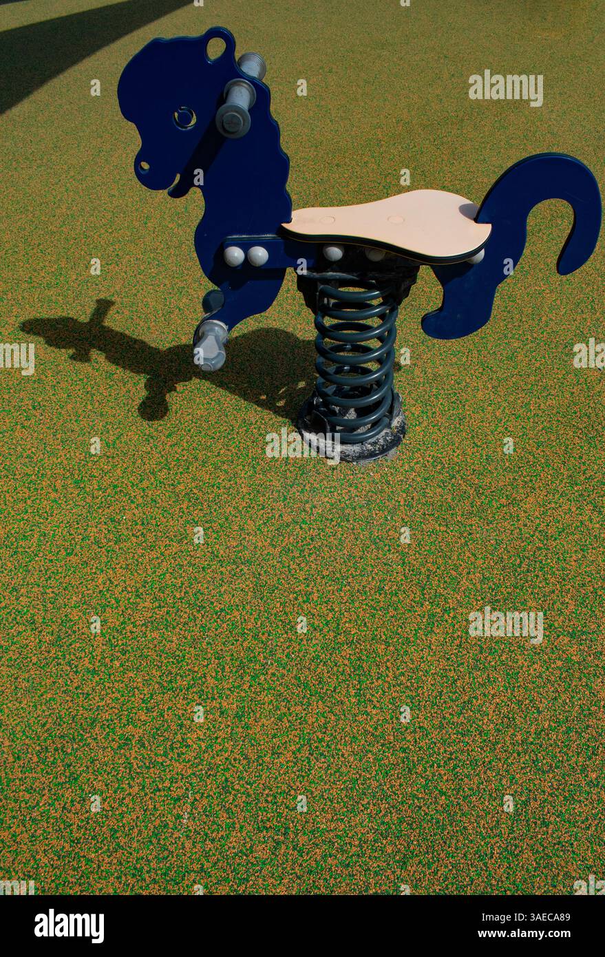 A sheep-shaped spring rider (spring rocker) in a public playground ...