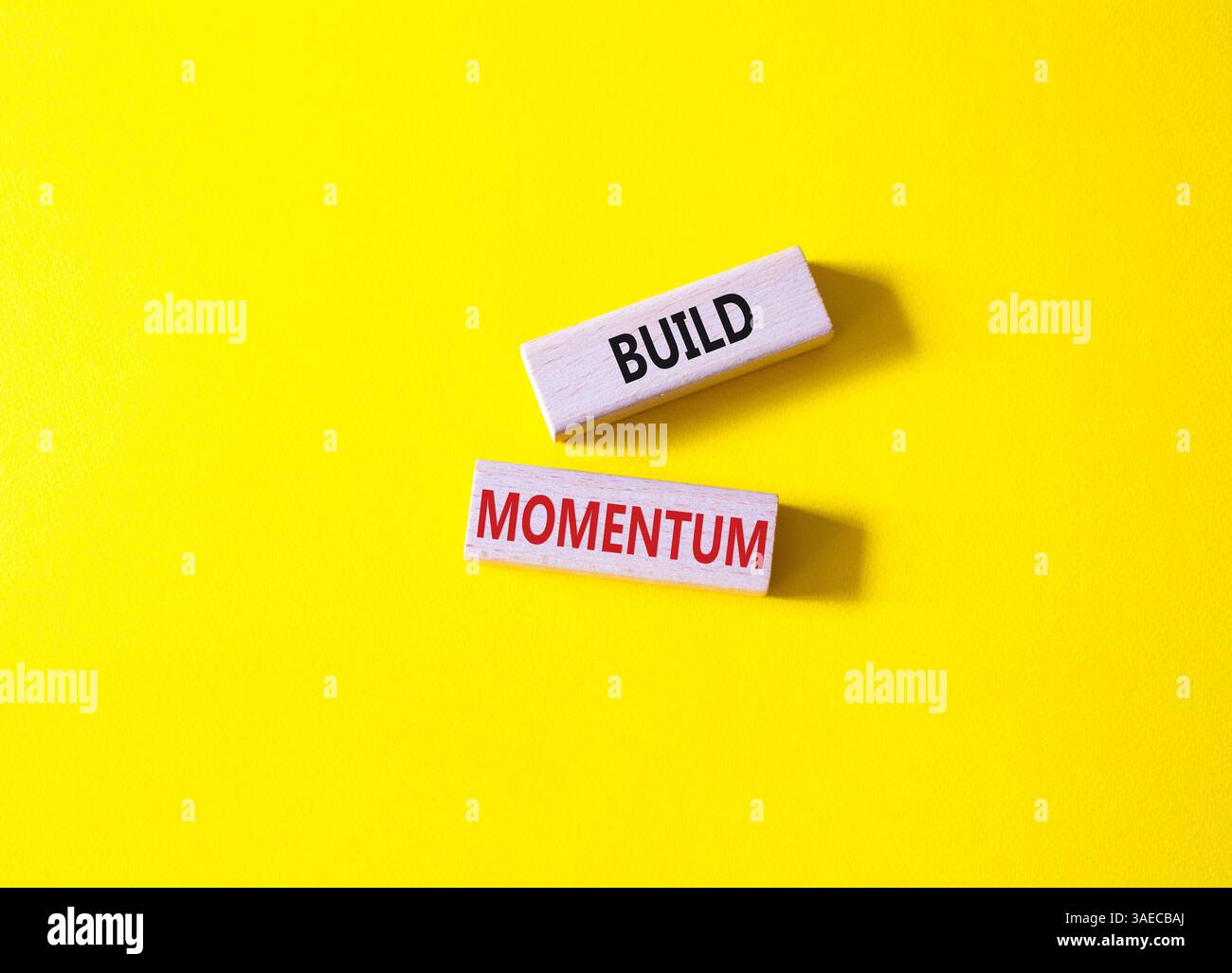 Build momentum symbol. Wooden blocks with words Build momentum ...