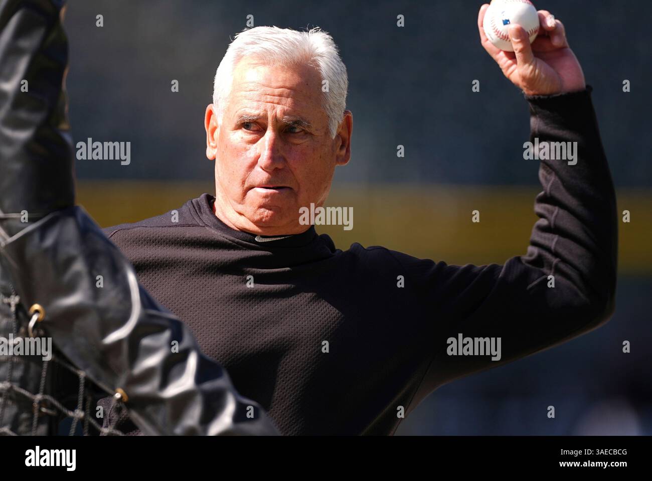 Colorado Rockies manager Bud Black (10) warms up before a baseball game ...