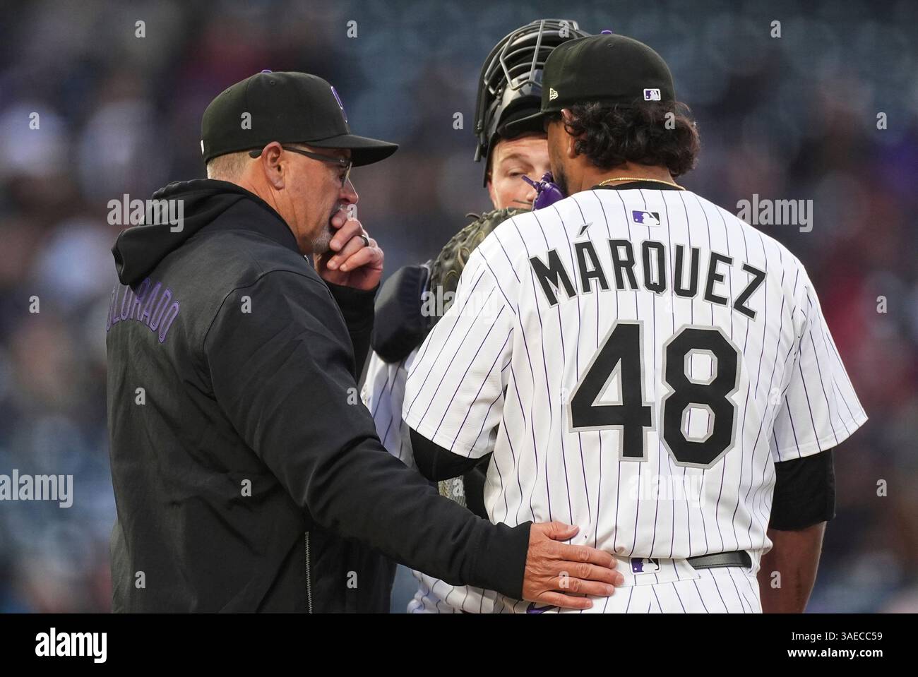 Colorado Rockies pitching coach Darryl Scott (72) confers with Colorado ...