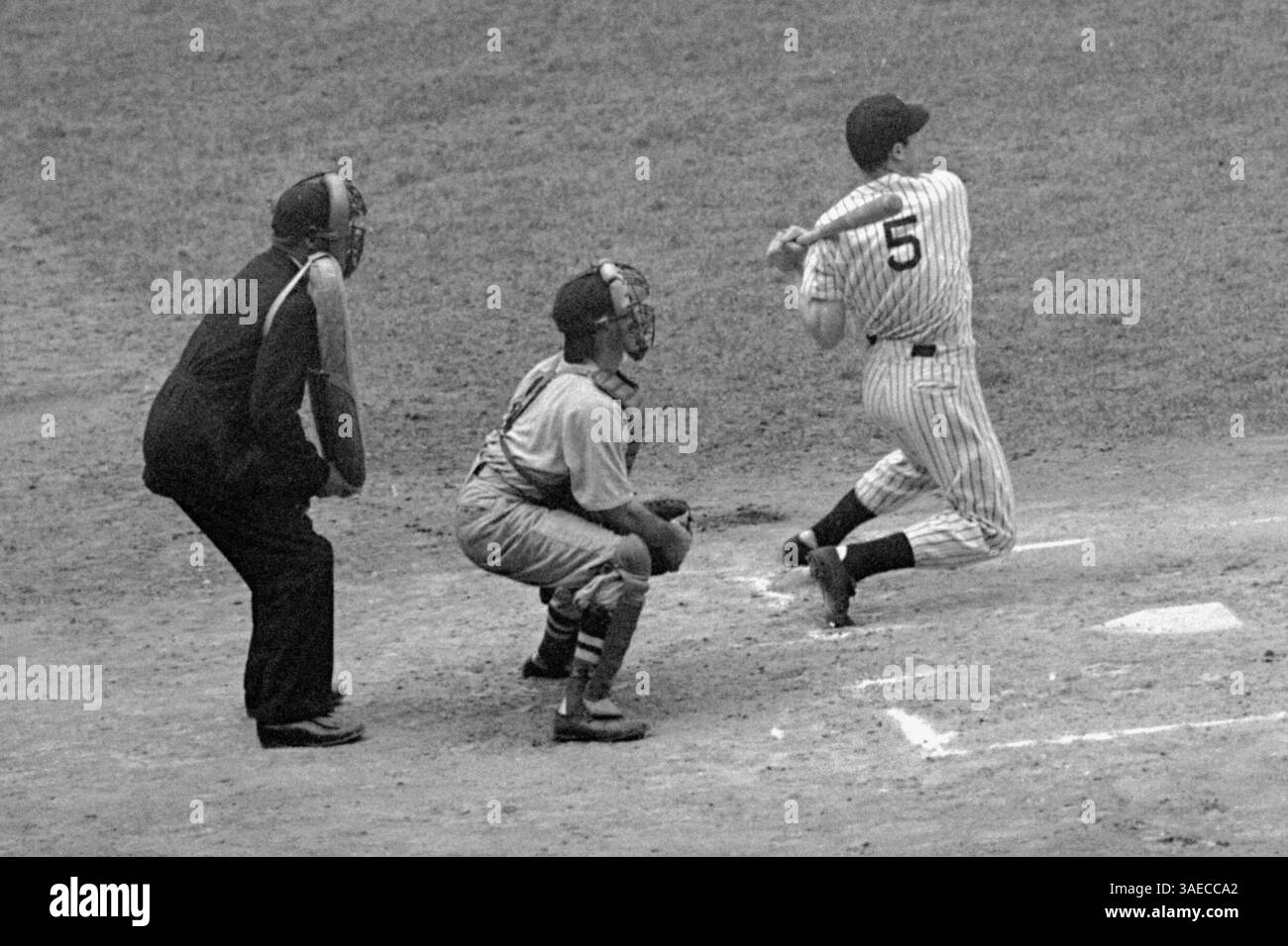 FILE - New York Yankees' Joe DiMaggio singles to center in the first ...