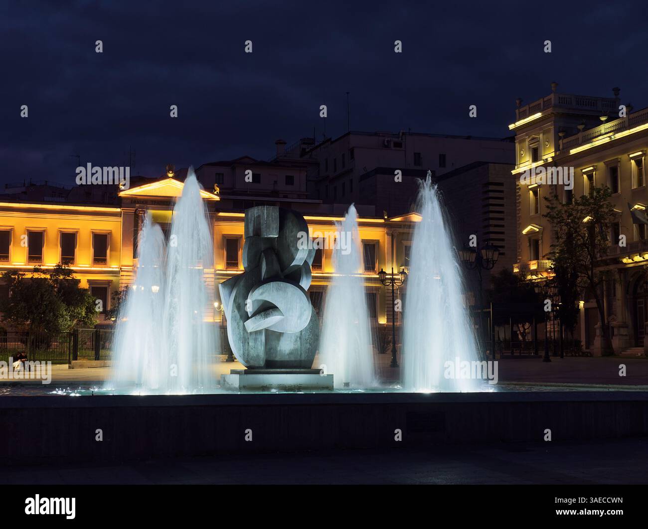 Athens, Greece - April 5, 2025: Illuminated fountains and modern ...