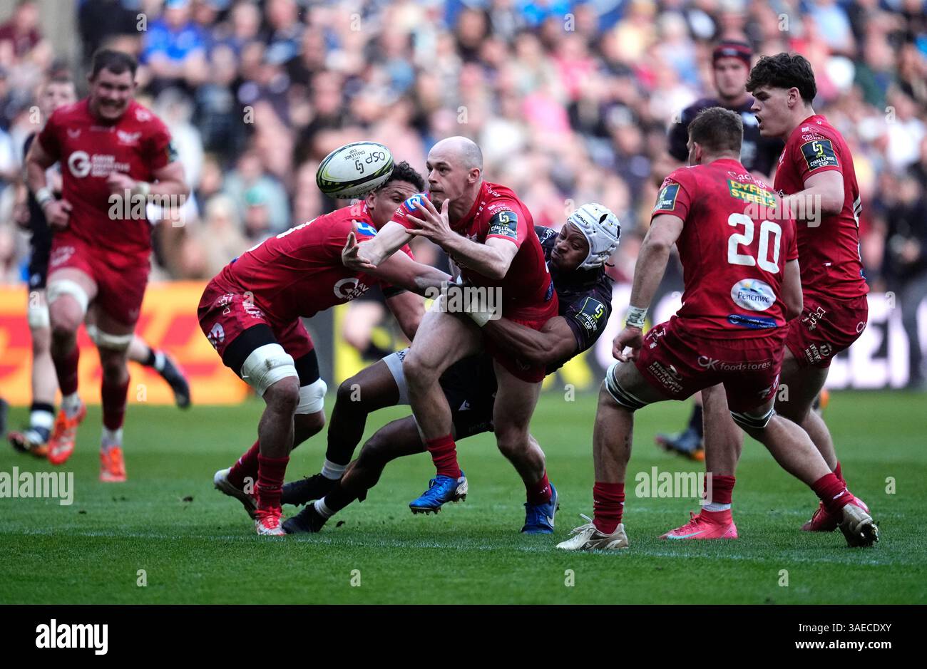 Scarlets' Ioan Nicholas is tackled by Ospreys' Dan Kasende during the ...